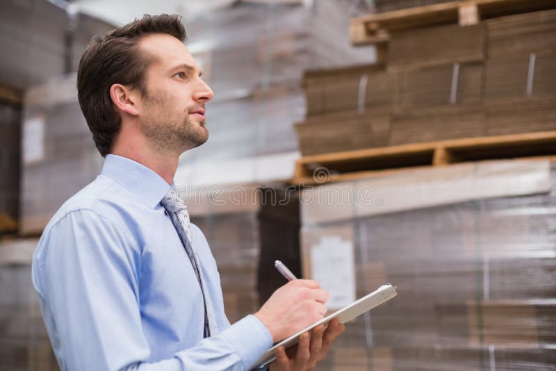 Warehouse Manager Checking His Inventory Stock Image - Image of ...