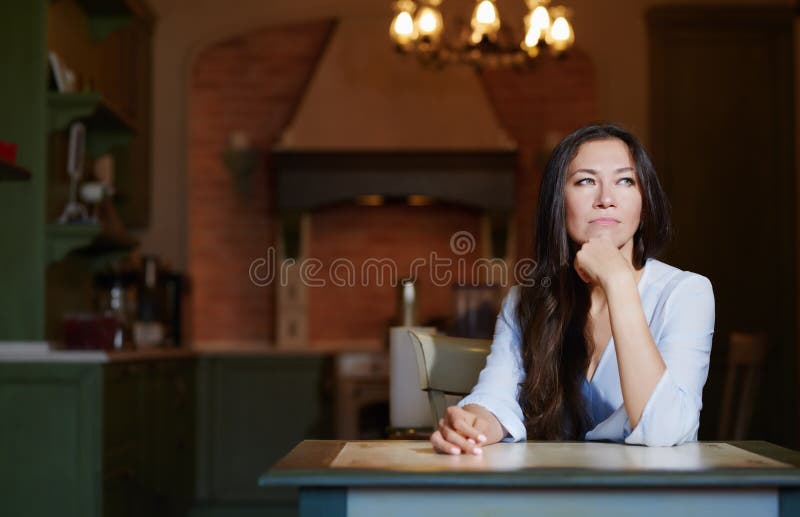 Serious Woman Sitting at the Table Stock Photo - Image of authenticity ...