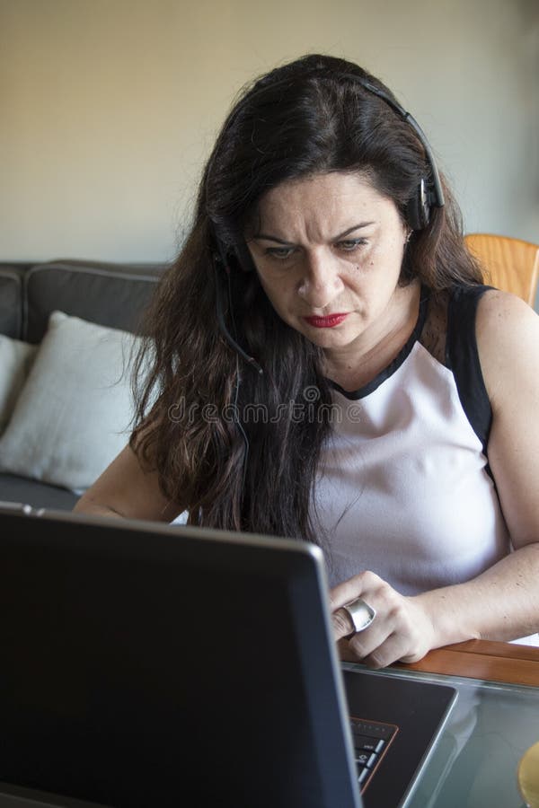 Serious Woman Working on Her Laptop at Home Office Stock Photo - Image ...