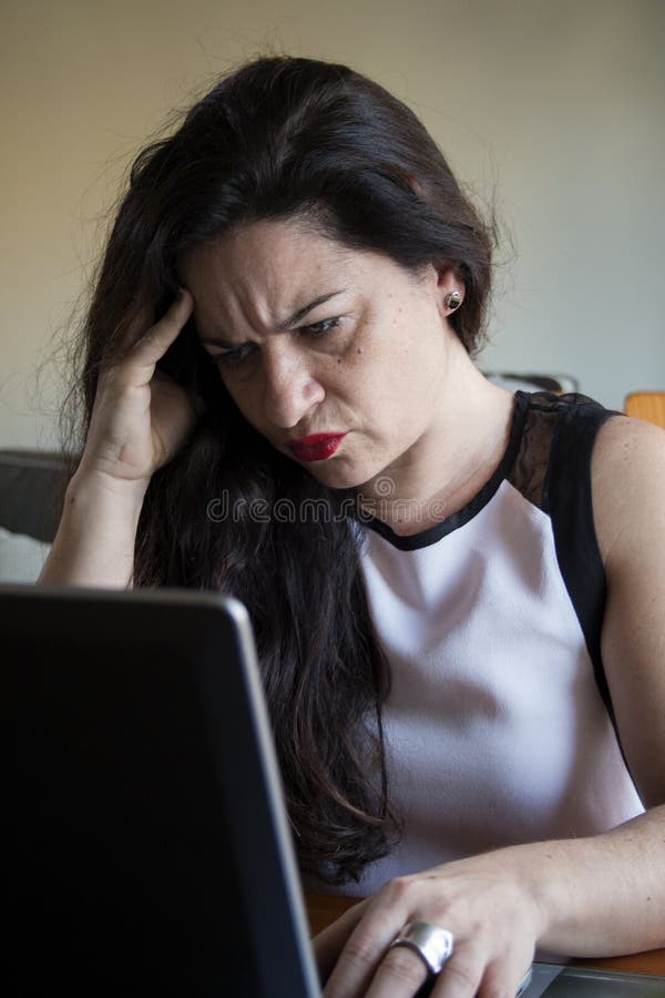 Serious Woman Working on Her Laptop at Home Office Stock Photo - Image ...