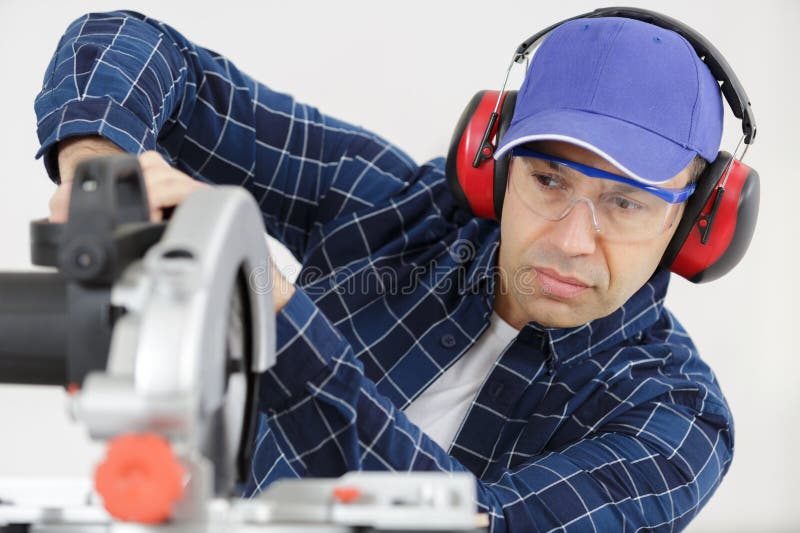 Serious Worker Cutting Metal Bar with Circular Saw Stock Image - Image ...