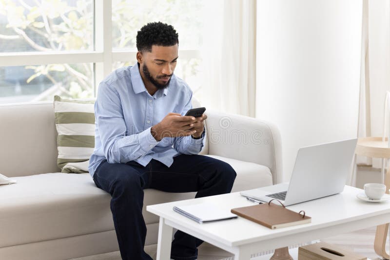 Serious Young African Freelance Business Man Using Internet Technology ...