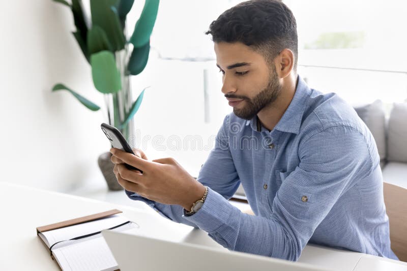 Serious Young Arab Employee Man Focused on Online Browsing Stock Photo ...