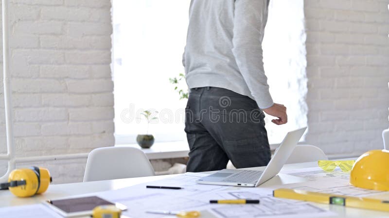Serious Young Architect Standing Up Going Away at Work Stock Image ...