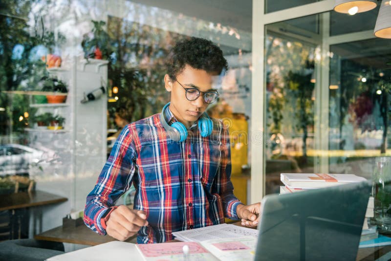 Serious Young Boy Focusing on His School Task Stock Image - Image of ...
