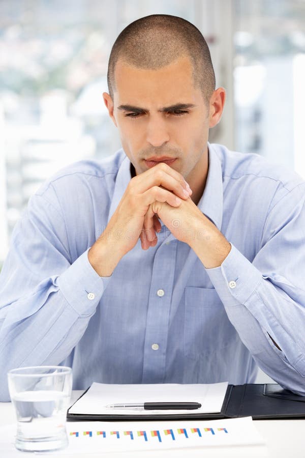 Serious young businessman stock image. Image of suit - 20597391