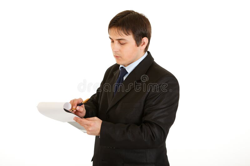Serious Young Businessman Making Notes in Document Stock Image - Image ...