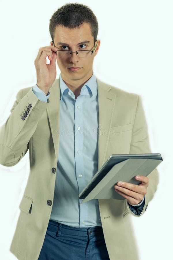 Serious Young Male Using Digital Tablet Checking News or Information in ...