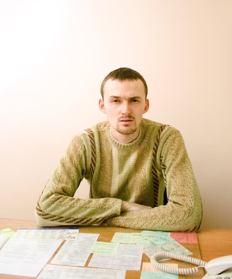 Serious young man stock image. Image of clerk, phone, workplace - 5846155