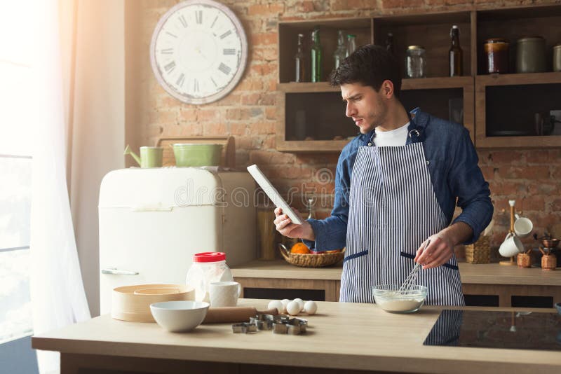 Serious Young Man Baking in Loft Kitchen Stock Photo - Image of cook ...