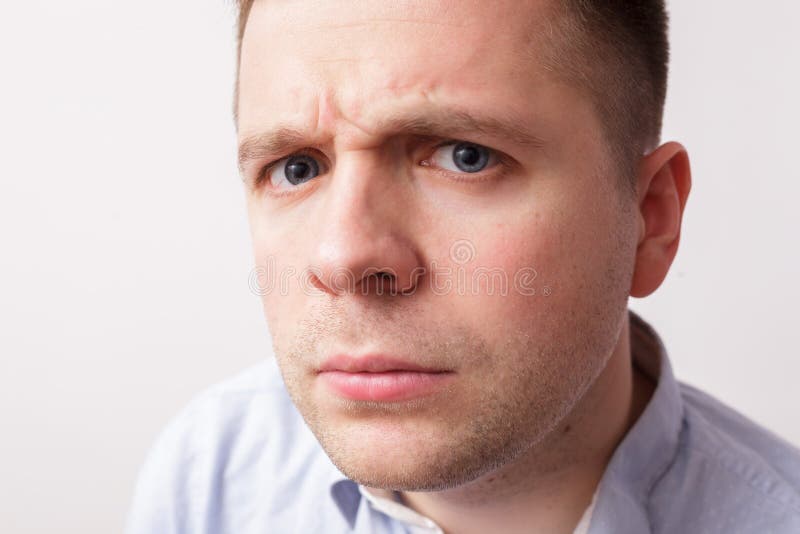 Young Man Frowned Angrily Looks into the Camera at Close Range Stock ...