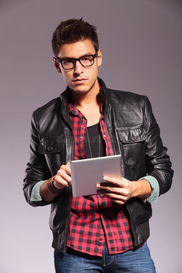 Serious Young Man Holding a Tablet Pad Stock Photo - Image of handsome ...