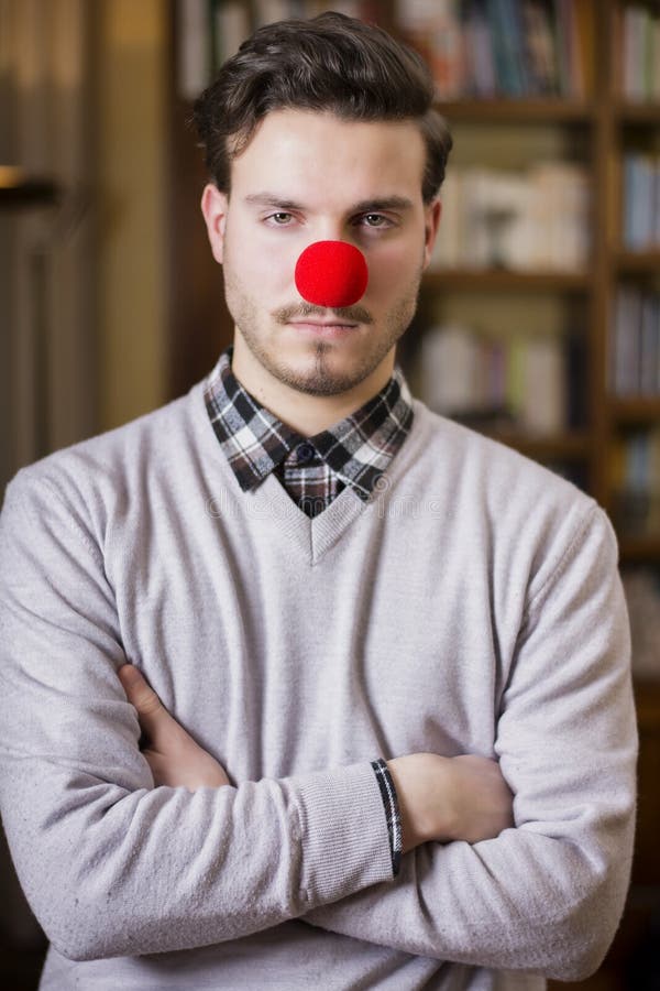 Serious Young Man with Red Clown Nose Stock Photo - Image of people ...