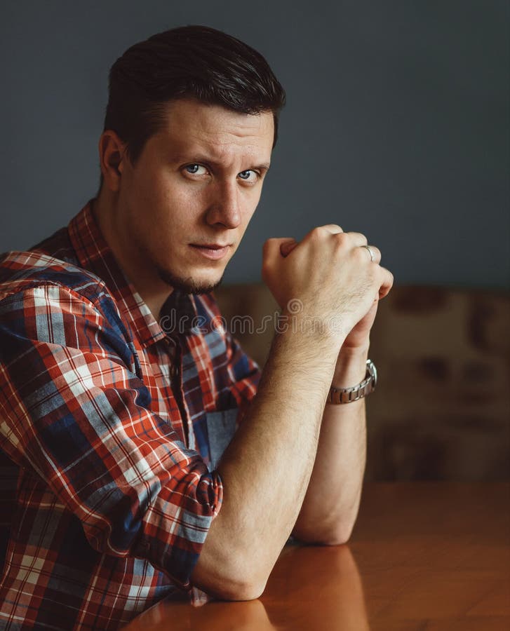 Serious Young Man Sitting at the Table Stock Image - Image of beard ...