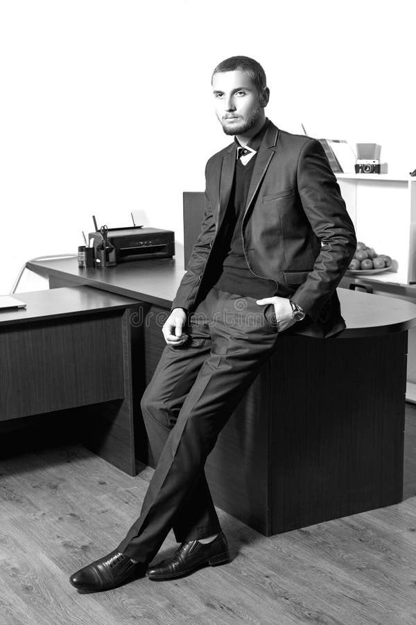 Serious Young Man in a Suit in an Office Stock Photo - Image of indoors ...