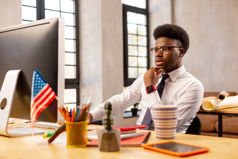 Serious Young Man Working in the Office Stock Image - Image of serious ...