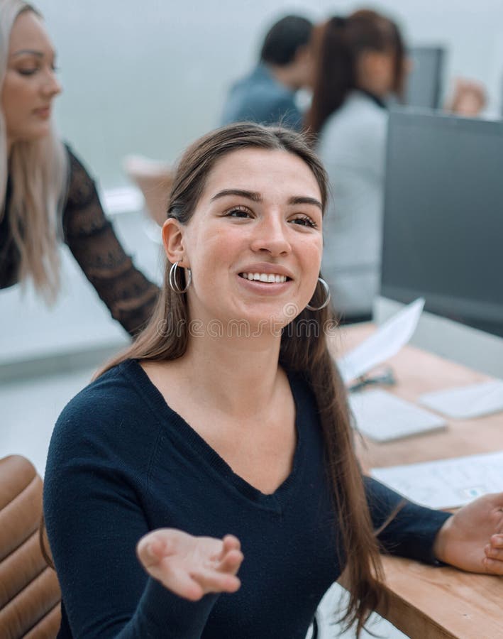 Serious Young Woman Asking a Question To Her Colleague Stock Photo ... Serious Young Woman Asking a Question To Her Colleague Stock Photo ...