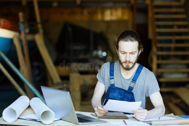 Engineer reading paper stock photo. Image of businessman - 120793984