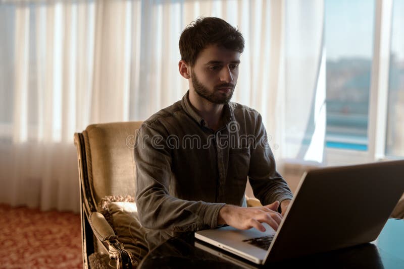 Seriously and Young Hipster Guy Using Laptop Computer, Person Work at ...