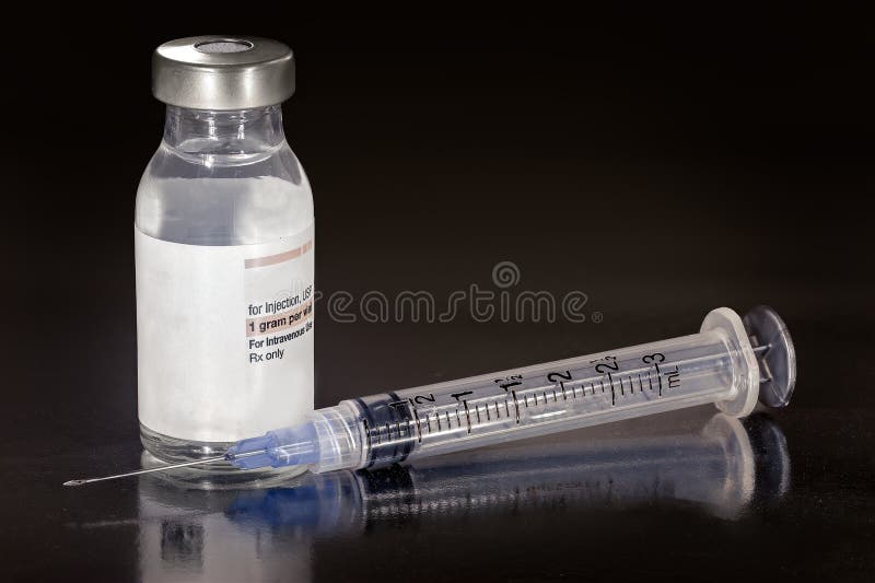 Serum, Vaccine in a Bottle and an Injection Needle Stock Image - Image ...