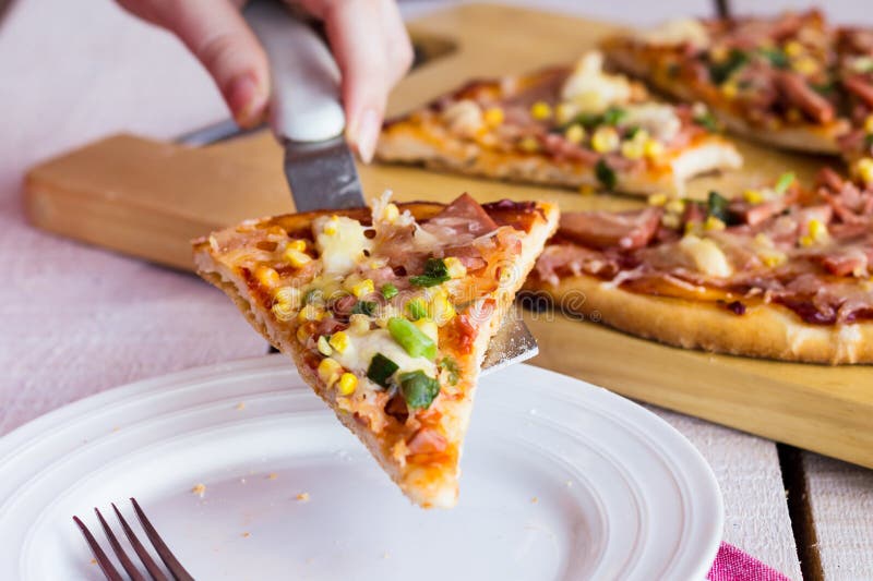 Serve a slice of pizza stock photo. Image of entertain - 43025864