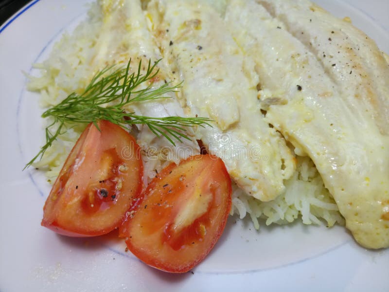 Oily Cod Meal with Rice and Tomatoes Stock Photo - Image of white, meal ...