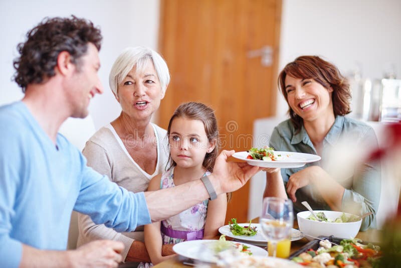 Served with Love. a Multi-generational Family Having a Meal Together ...
