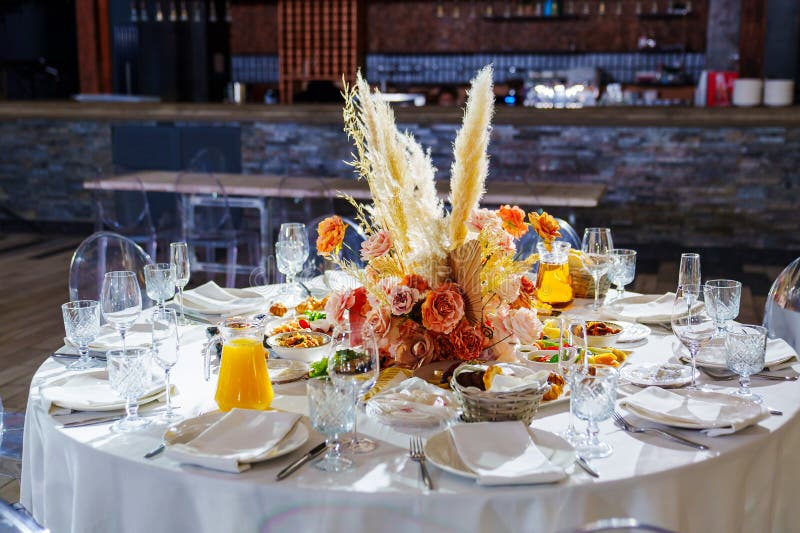 Served Round Table with Empty Dishes, Snacks and a Bouquet of Flowers ...