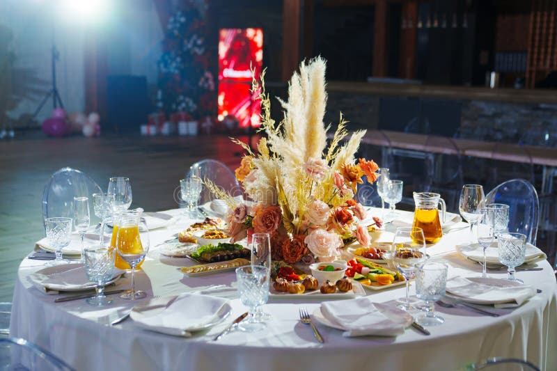 Served Round Table with Empty Dishes, Snacks and a Bouquet of Flowers ...