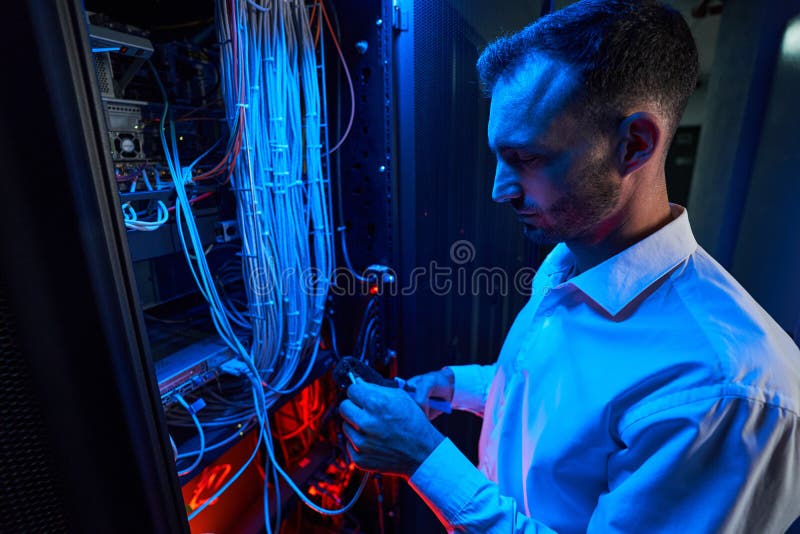 Server Administrator Putting Twisted Pair into Crimping Tool Stock ...