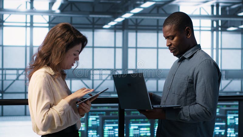 Server Farm Workers Using Devices To Perform Vulnerability Scans Stock ...