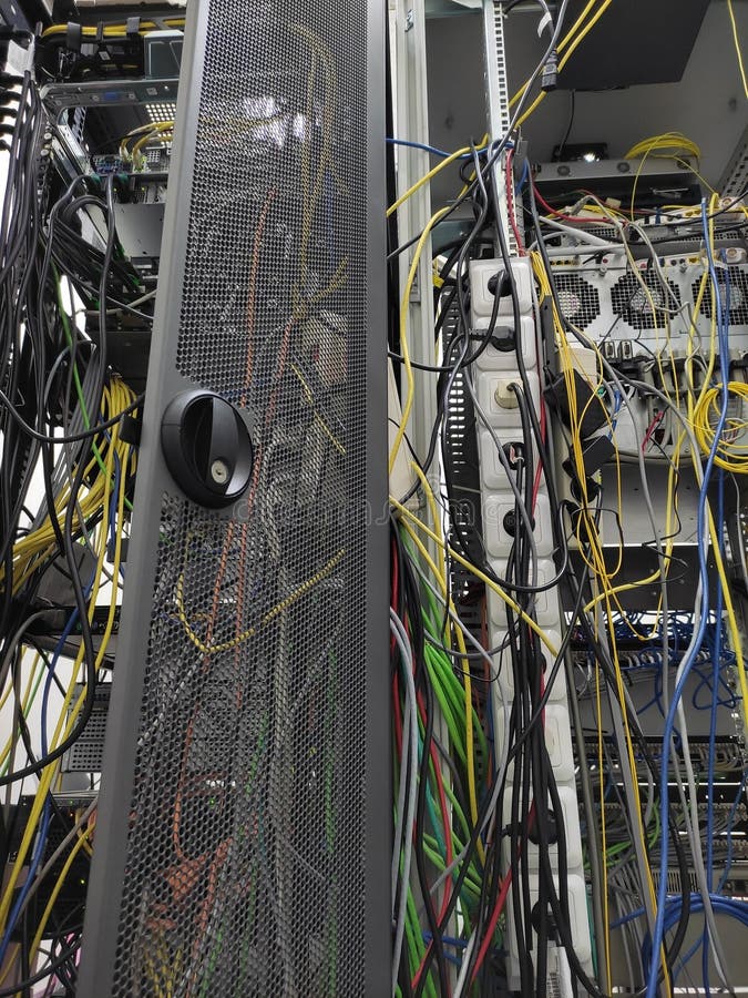 Server Rack Filled with Network Equipment and a Tangle of Colorful ...