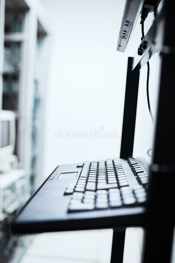 The Server Room. a Computer Monitor and Keyboard Inside of a it Server ...