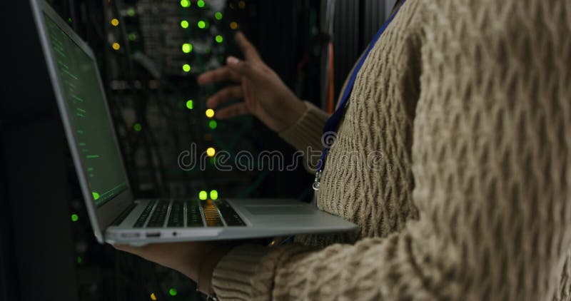 Cyber Security, Laptop and Black Man in Server Room, Maintenance or Database Cables Check ...