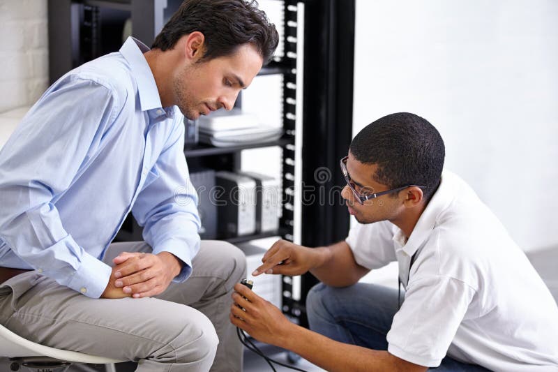 Server Room, it Support and Hardware with a Technician Showing a Cable ... Server Room, it Support and Hardware with a Technician Showing a Cable ...