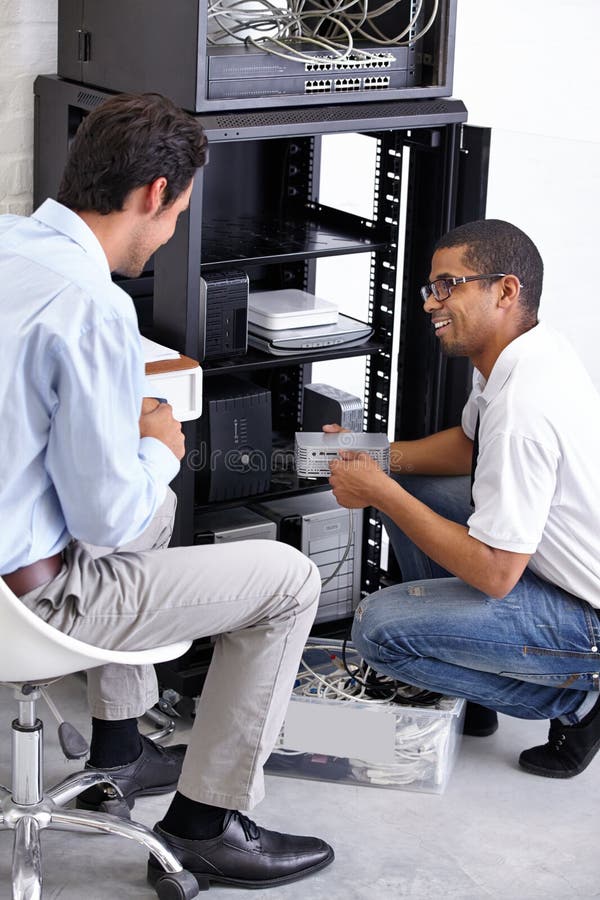 Server Room, it Support and Maintenance with an Engineer Talking To a ... Server Room, it Support and Maintenance with an Engineer Talking To a ...