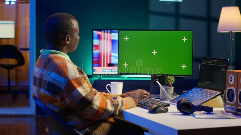 Server Technician Optimizing Program and Next To Green Screen Stock ...