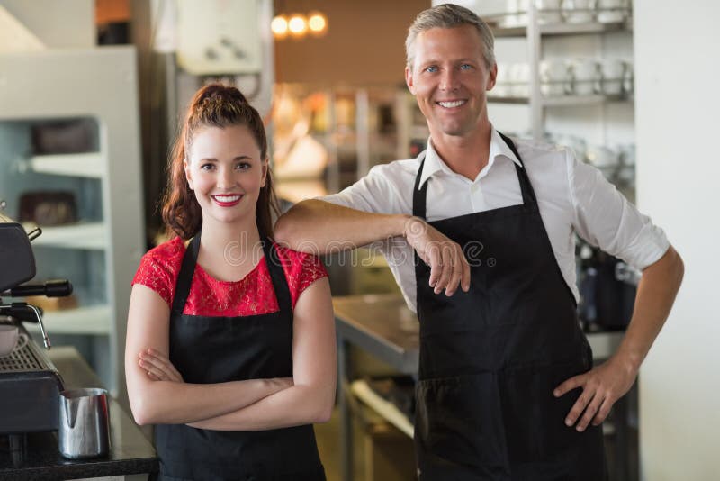 Servers Smiling at the Camera Stock Photo - Image of caucasian, crossed ...