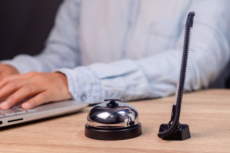 A Service Bell or Call Bell and a Pen on the Receptionist Desk Stock ...