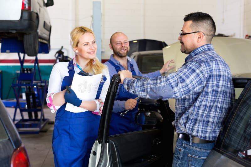 Service Crew and Driver Near Car Stock Photo - Image of male, center ...