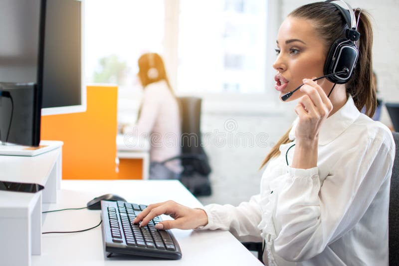 It Service Desk Female Operator Talking To Client Using Headset and ...