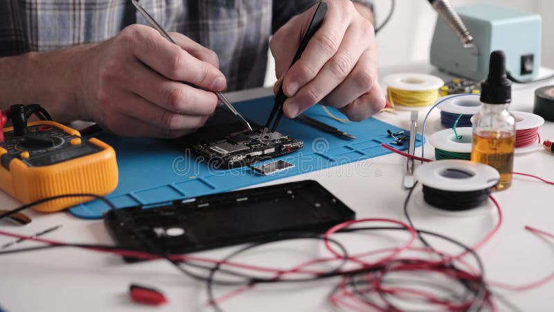 Service Man Disassembling Broken Smartphone for Fixing in Repair ...