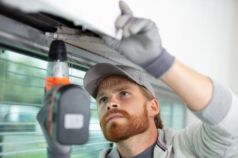 Service Man Installing Window with Drill Stock Image - Image of glass ... Service Man Installing Window with Drill Stock Image - Image of glass ...