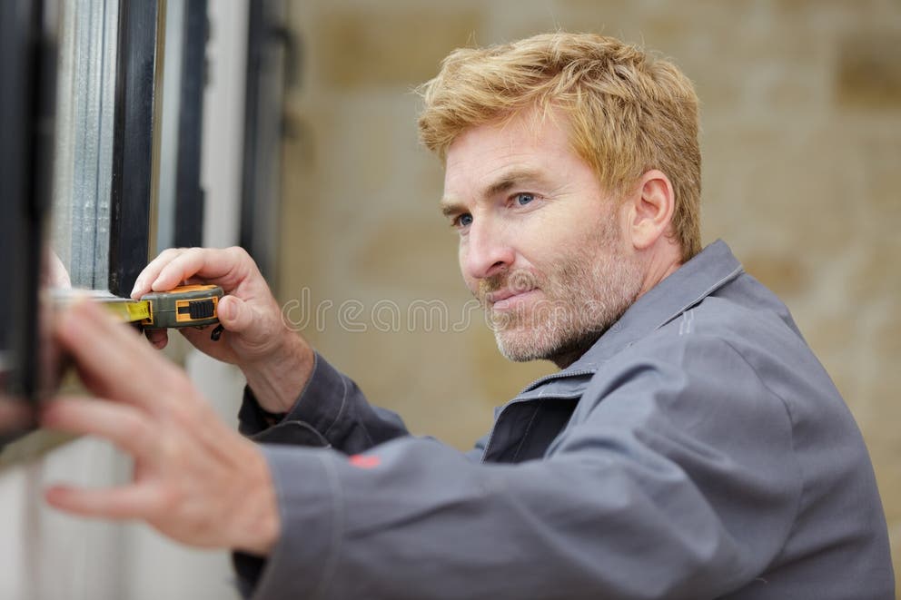 Service Man Installing Window with Measure Tape Stock Image - Image of ...