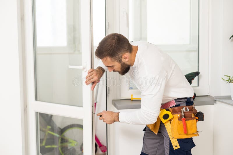 Service Man Installing Window with Screwdriver Stock Image - Image of ...