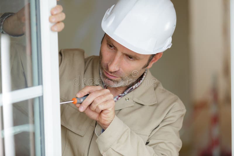 Service Man Installing Window with Screwdriver Stock Photo - Image of ... Service Man Installing Window with Screwdriver Stock Photo - Image of ...