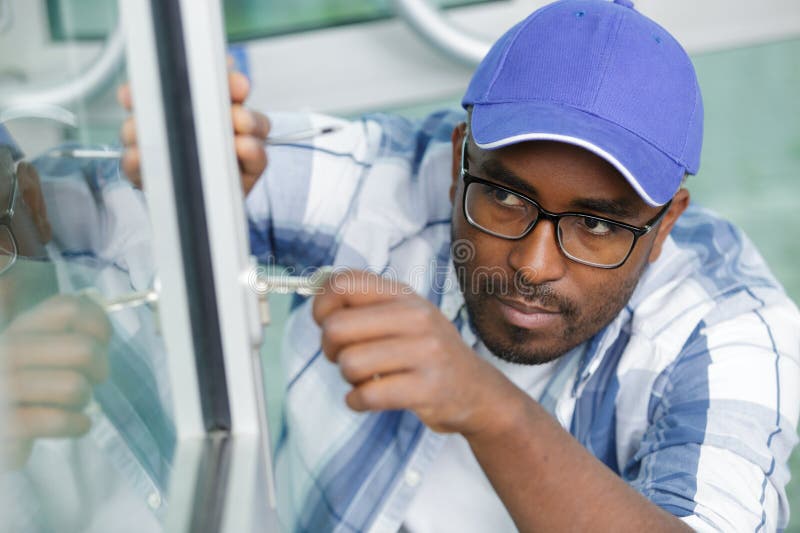 Service Man Installing Window with Screwdriver Stock Image - Image of ... Service Man Installing Window with Screwdriver Stock Image - Image of ...
