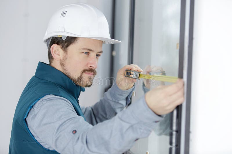 Service Man Measuring Window for Installation Indoors Stock Photo ...