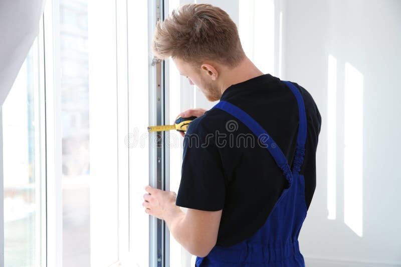 Service Man Measuring Window for Installation Stock Image - Image of ...