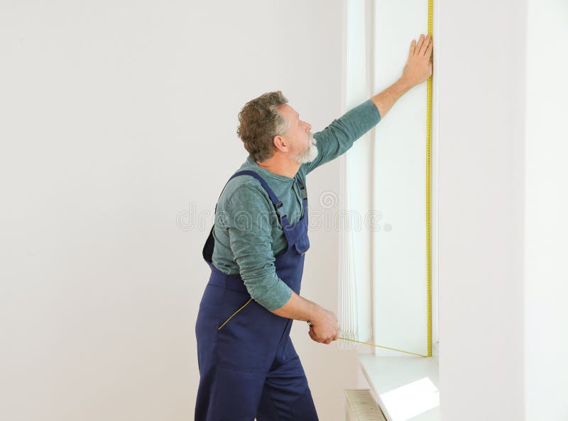 Service Man Measuring Window for Installation. Space for Text Stock ... Service Man Measuring Window for Installation. Space for Text Stock ...